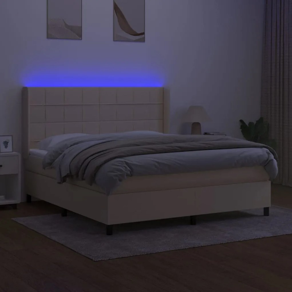 Box spring postel s matrací a LED krémová 180x200 cm textil 3138338