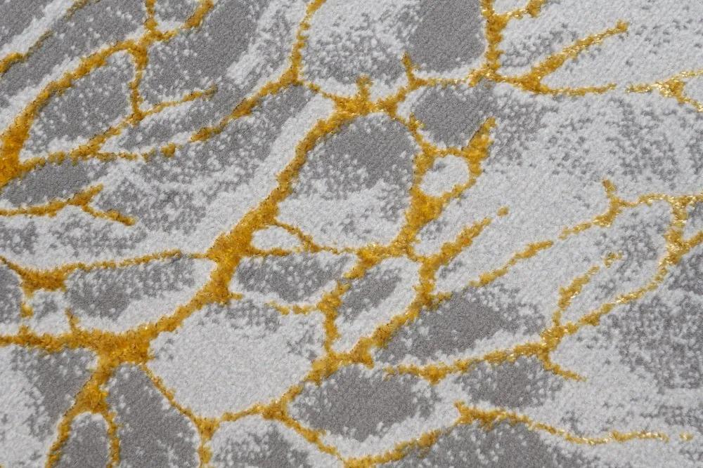 Jednoduchý moderní koberec v šedé barvě se zlatým motivem Šířka: 200 cm | Délka: 300 cm