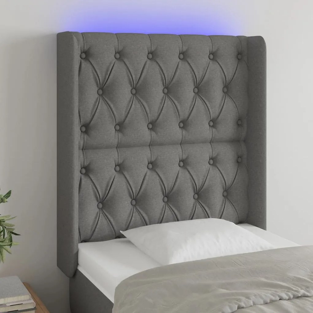 Čelo postele s LED tmavě šedé 83 x 16 x 118/128 cm textil