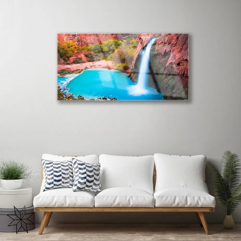 Obraz na skle Vodopád Hory Příroda 140x70 cm