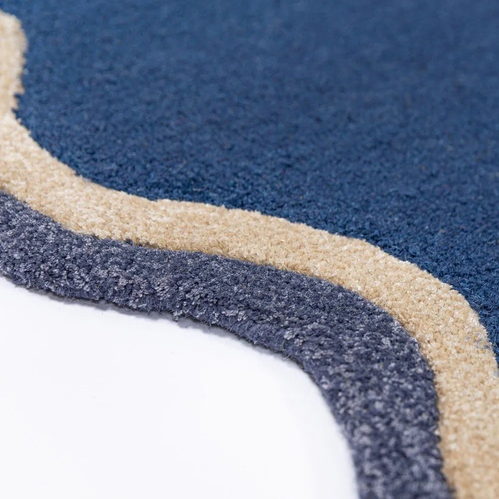 Tmavě modrý ručně tkaný koberec s příměsí vlny 120x170 cm Rivo Wool – Flair Rugs
