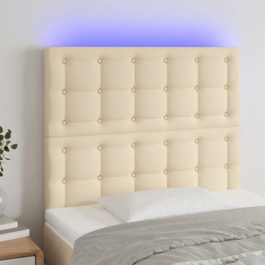 Čelo postele s LED krémové 90x5x118/128 cm textil
