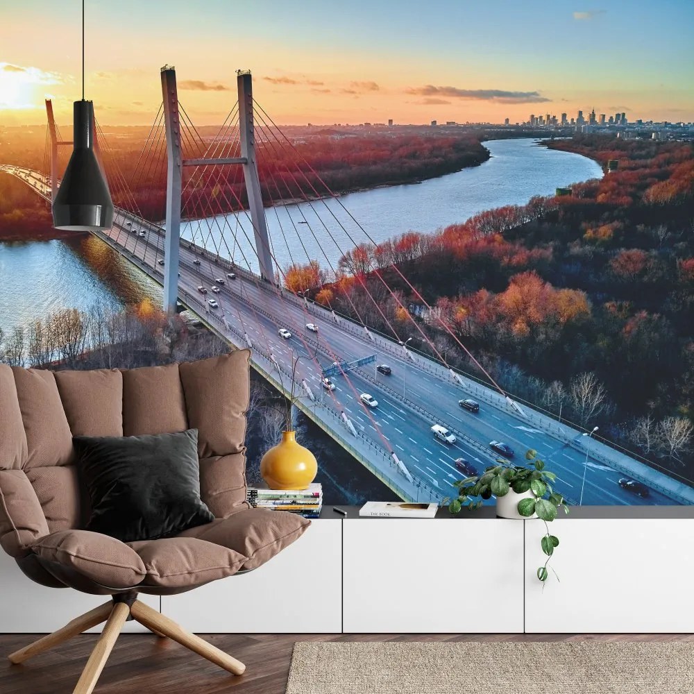 Fototapeta Beautiful Panoramic Aerial Drone View To Cable-Stayed Siekierkowski Bridge Over The Vistula River And Warsaw City Skyscrapers, Poland In Gold Red Autumn Colors In November Evening At Sunset Hladký vinyl 152.5x104