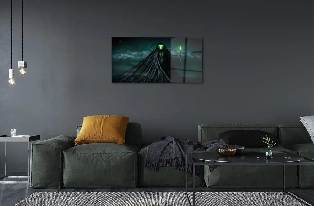 Obraz na skle Temná postava zeleného ohně 125x50 cm