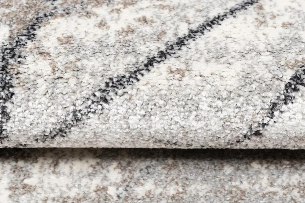 Moderní béžový koberec s motivem jemných lístků Šířka: 80 cm | Délka: 150 cm