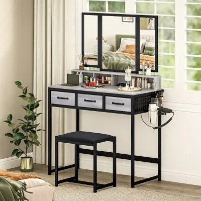 HOMCOM toaletní stolek s odnímatelným trojitým zrcadlem, stolička, 3 látkové zásuvky, držák na fén, šedý
