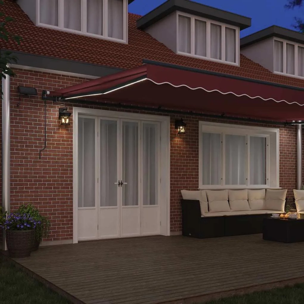 Ručně zatahovací markýza s LED světly burgundská 600 x 300 cm 3310200