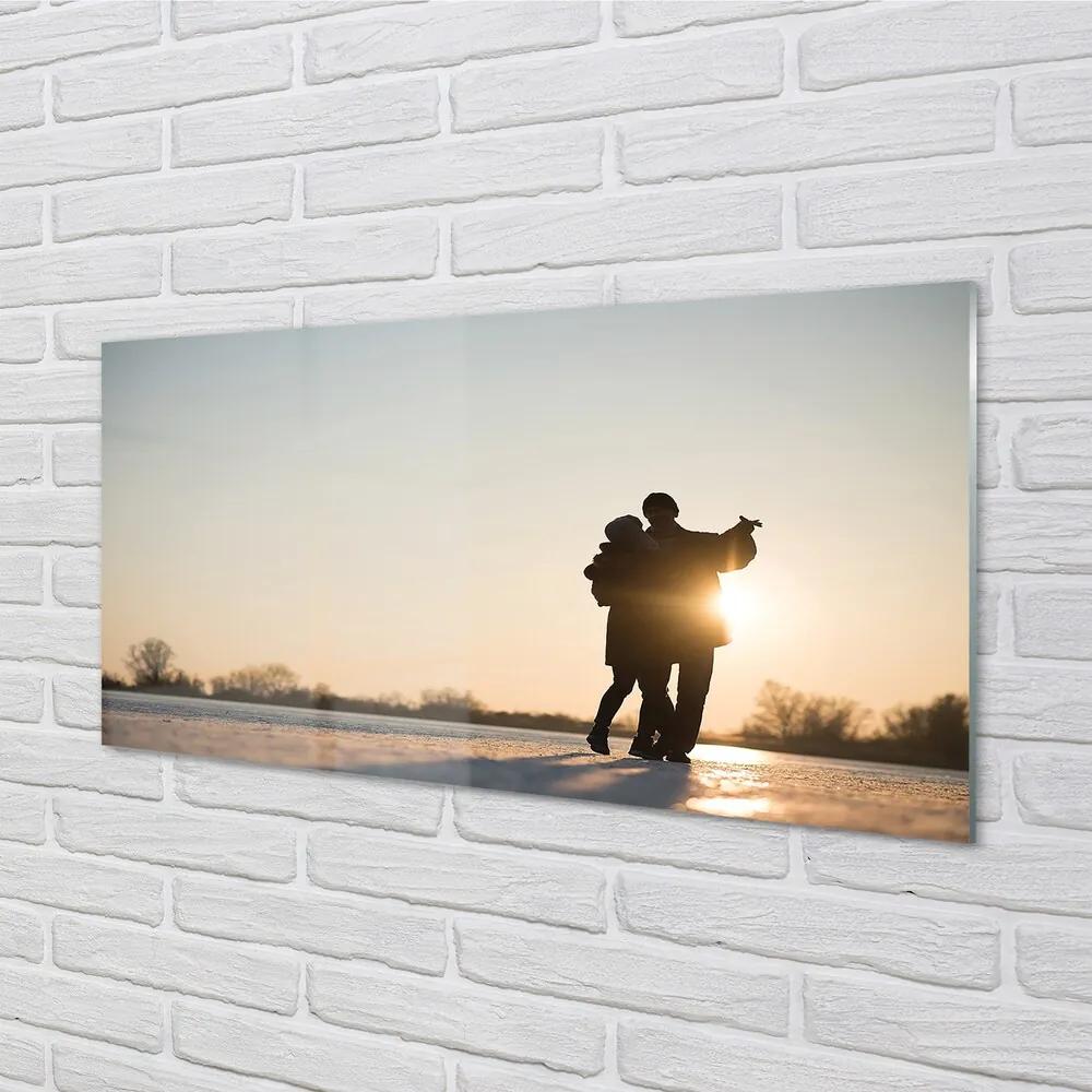 Obraz na skle Lidé tančí v zimě 100x50 cm