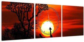 Obraz - Siluety zvířat při západu slunce (s hodinami) (90x30 cm)