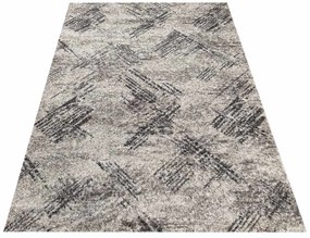 Moderní béžový koberec s jemným vzorem