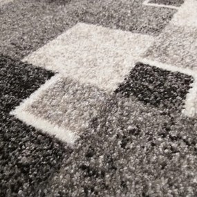 Originální koberec s motivem čtverců béžové barvy Šířka: 120 cm | Délka: 170 cm