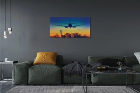 Obrazy na plátně Velkoměsto oblačnosti letadlo západ 140x70 cm
