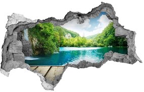 Wallmuralia Díra 3D ve zdi nálepka Vodopád v lese 95x73 cm