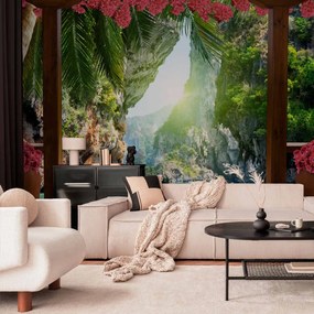 Fototapeta Tropický výhled - krajina s tyrkysovou vodou, palmami a květy