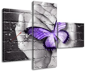 Gario Obraz s hodinami Fialový motýl na dlaních - 3 dílný Rozměry: 100 x 70 cm
