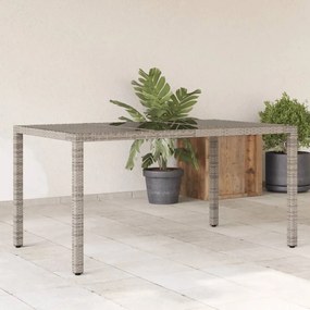 vidaXL Zahradní stůl se skleněnou deskou šedý 150x90x75 cm polyratan