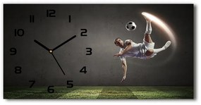 Wallmuralia Moderní skleněné hodiny na stěnu Fotbalista 60x30 cm
