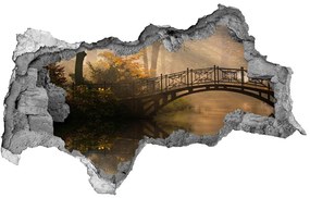 Wallmuralia Díra 3D ve zdi nálepka Starý most podzim 95x73 cm