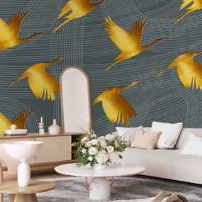 Fototapeta Létající zlatí jeřábi - abstrakce s ptáky na pruhovaném pozadí