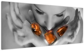 Obraz - oranžové kameny v dlani (100x40cm)