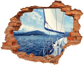 Wallmuralia Díra 3D ve zdi nálepka Plachetnice na pozadí moře 90x70 cm