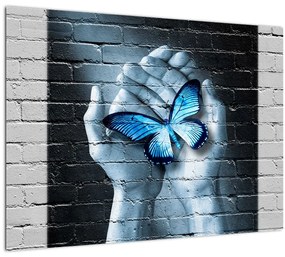Skleněný obraz modrého motýla na zdi (70x50 cm)
