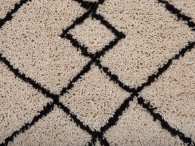 Béžový koberec s černým vzorem 140 x 200 cm HAVSA Beliani