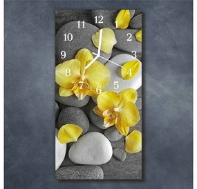 Nástěnné hodiny obrazové na skle - Orchidej žlutá na kamení
