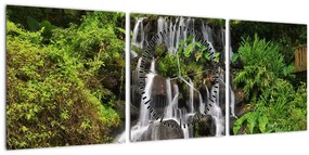 Obraz vodopádů v tropickém lese (s hodinami) (90x30 cm)