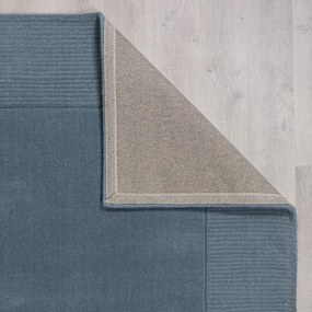 Tmavě modrý ručně tkaný vlněný koberec 120x170 cm Textured Wool Border – Flair Rugs