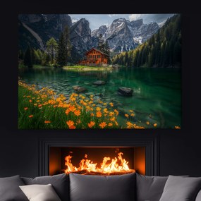 Obraz na plátně - Rozkvetlá louka u jezera s chatou FeelHappy.cz Velikost obrazu: 180 x 120 cm