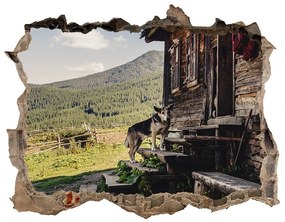 Wallmuralia Díra 3D ve zdi nálepka Dřevěný dům hory 95x64 cm