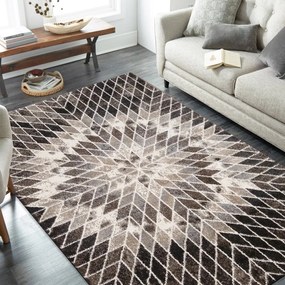 Hnědý vzorovaný koberec a abstraktním motivem Šířka: 120 cm | Délka: 170 cm