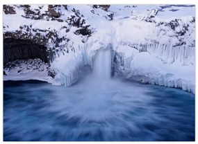 Skleněný obraz vodopádu v zimě (70x50 cm)