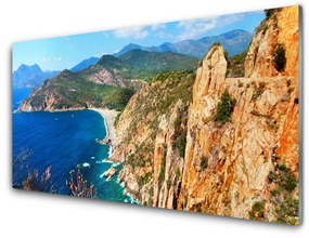 Obraz na skle Útes Pobřeží Moře Hory 140x70 cm