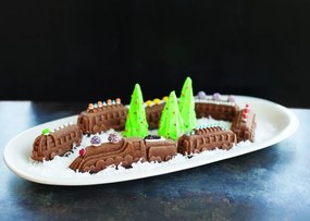 Nordic Ware Forma na bábovku Polární expres plát se 7 formičkami zlatá