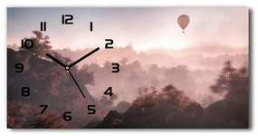 Wallmuralia Skleněné hodiny na stěnu Balon nad lesem 60x30 cm