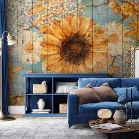 Fototapeta Slunečnice - kompozice květin na modrém pozadí s texturou dřeva