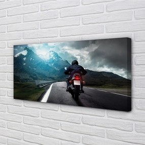 Obrazy na plátně Motocyklu horské silnici muž nebe 125x50 cm