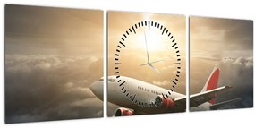 Obraz -  Letadlo v oblacích (s hodinami) (90x30 cm)