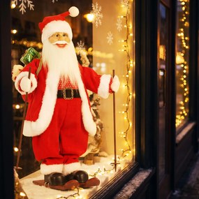 HOMCOM Zpívající lyžařský Santa Claus, 66 cm, stojící animovaná vánoční postava se lyžemi, pytlem s dárky a aktivací zvukem / dotykem