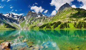 Fototapeta Horské jezero - krajina tyrkysového jezera mezi skalnatými horami