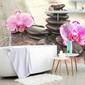 Fototapeta orchidej a Zen kameny na dřevě