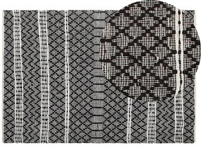 Kožený koberec 140 x 200 cm černý s béžovým FEHIMLI Beliani
