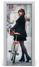 Fototapeta samolepící dveře žena na kole 75x205 cm