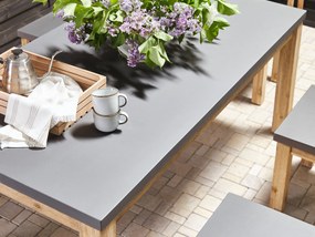 Zahradní stůl z betonu a akátového dřeva 180 x 90 cm OSTUNI Beliani