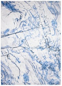 Jednoduchý bílý a modrý koberec s abstraktním vzorem