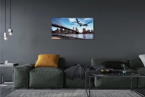 Obrazy na plátně Letadel mraky město 140x70 cm