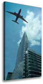 Wallmuralia Vertikální Foto obraz na plátně Letadlo nad městem 50x100