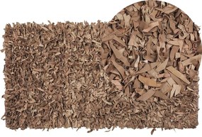 Béžový shaggy kožený koberec 80x150 cm MUT Beliani